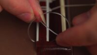 How to change strings on classical guitar