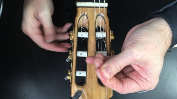 How to change strings on classical guitar