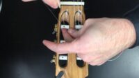 How to change strings on classical guitar