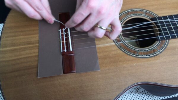 How to change strings on classical guitar
