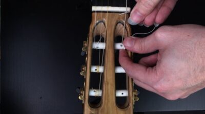 How to change strings on classical guitar