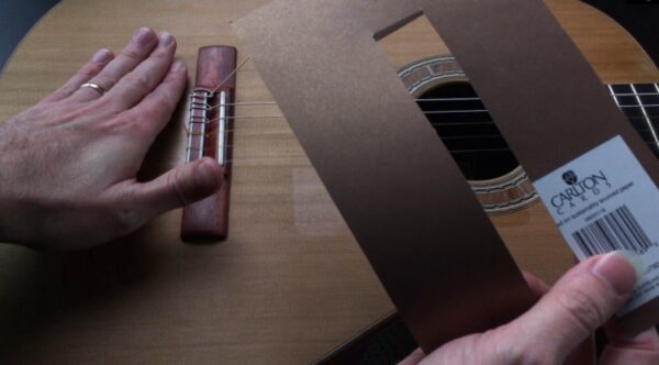 How to change strings on classical guitar
